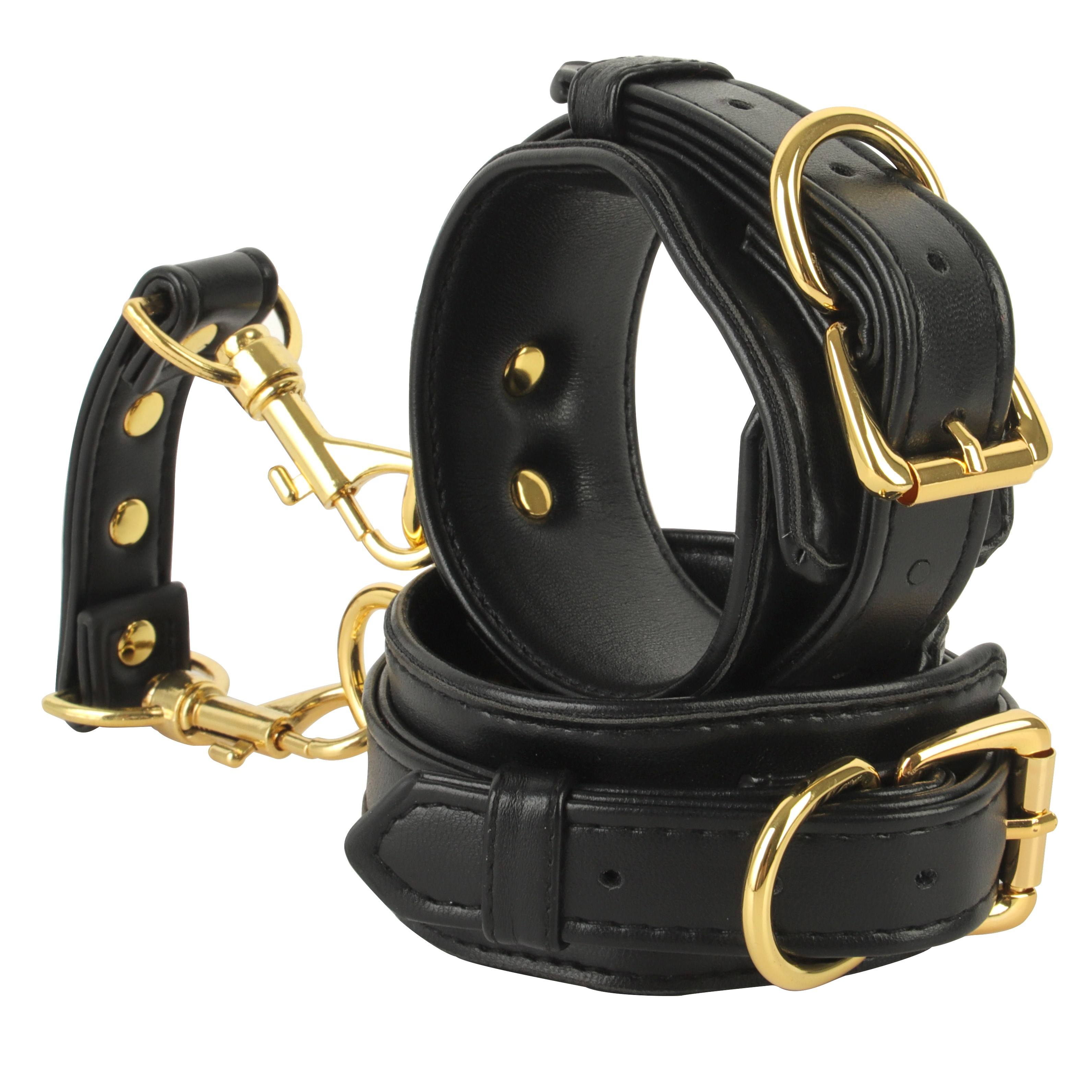 Handboeien van pu leer | zwart / goud | bondage
